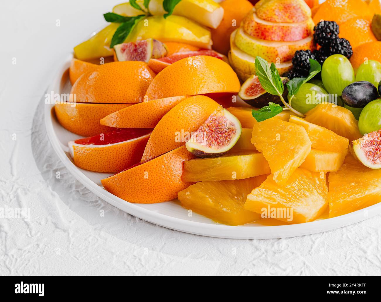 Exotic fruits platter isolated on white Stock Photo - Alamy