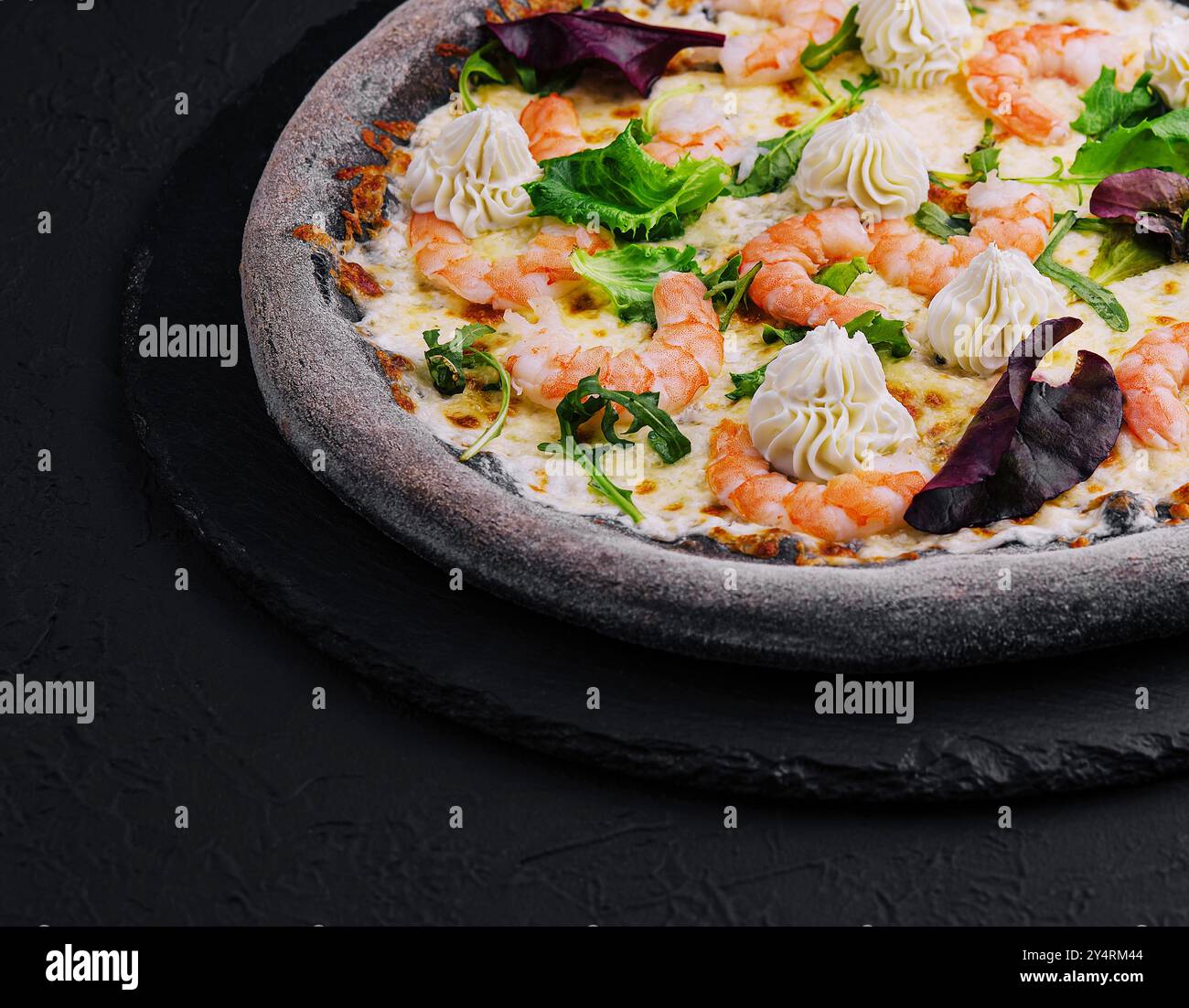 black pizza with shrimp and cream Stock Photo - Alamy