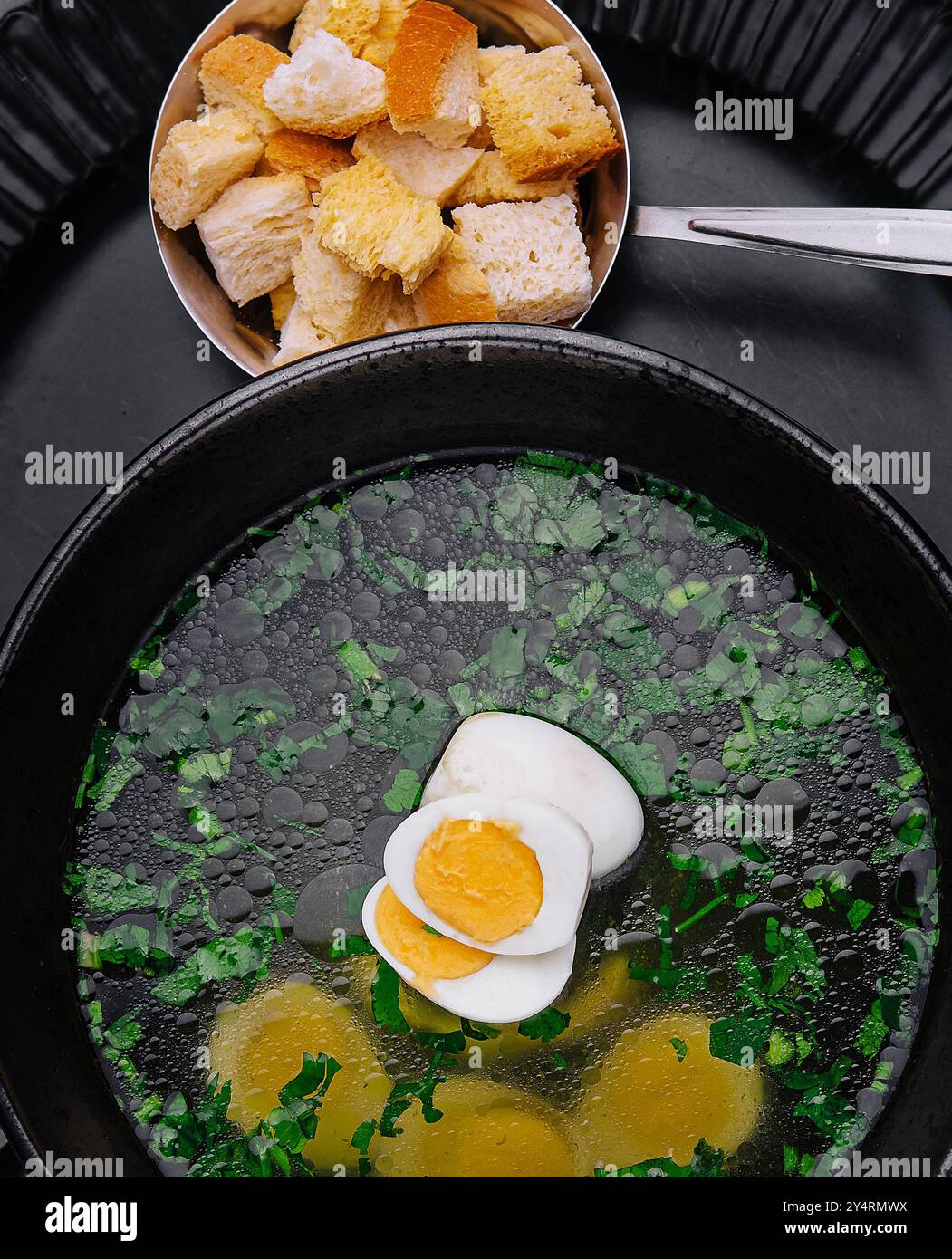 Homemade bouillon or broth with egg Stock Photo - Alamy