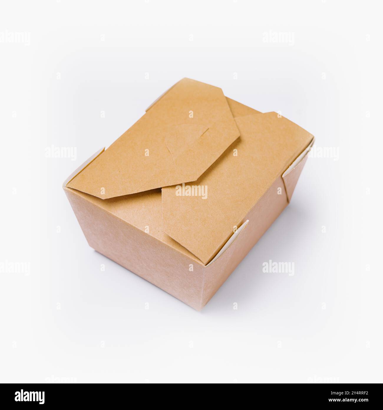 Closed brown cardboard takeout box isolated on a white backdrop ...