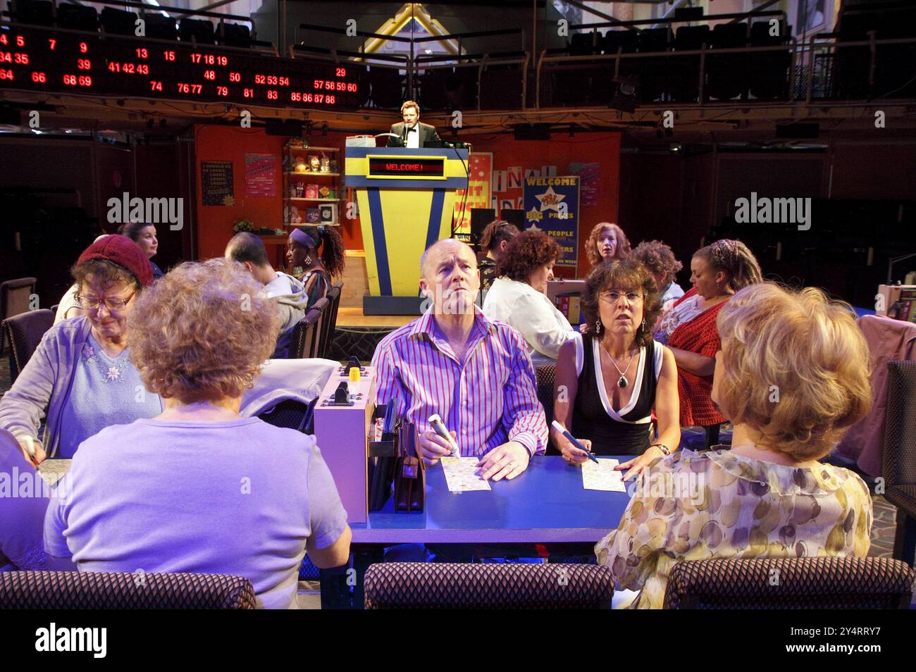 players with caller in backgroundin EVERYBODY LOVES A WINNER written ...