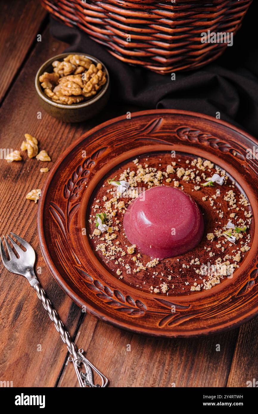 Aesthetic image of chocolate pudding topped with berry sorbet on a ...