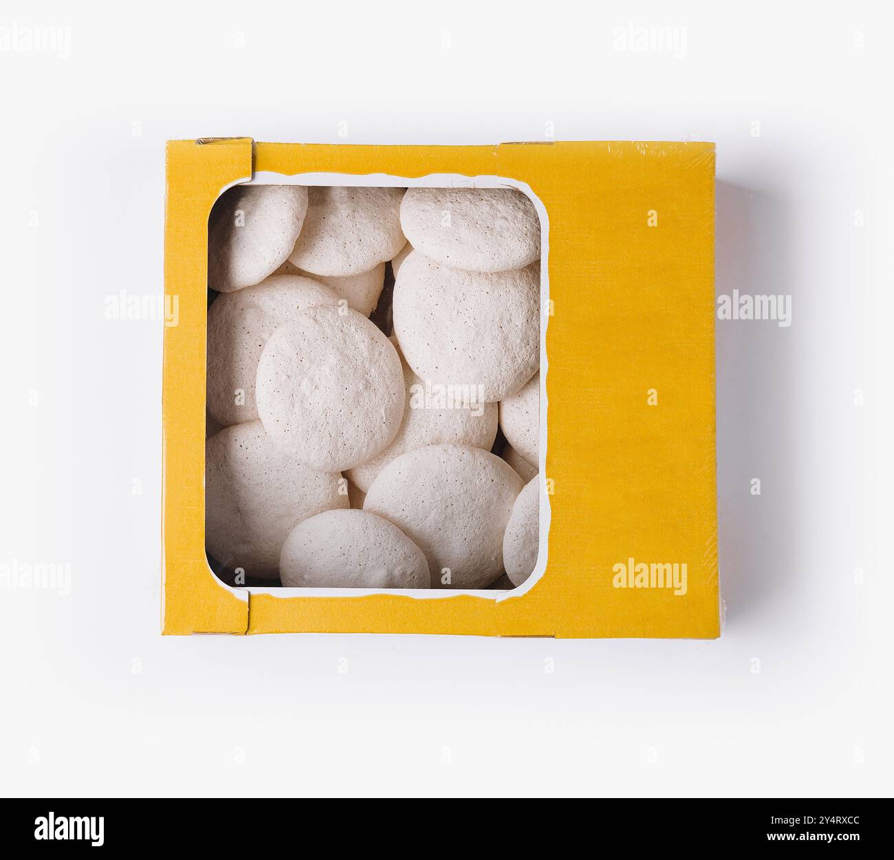 Top view yellow box of vanilla meringue cookies Stock Photo - Alamy