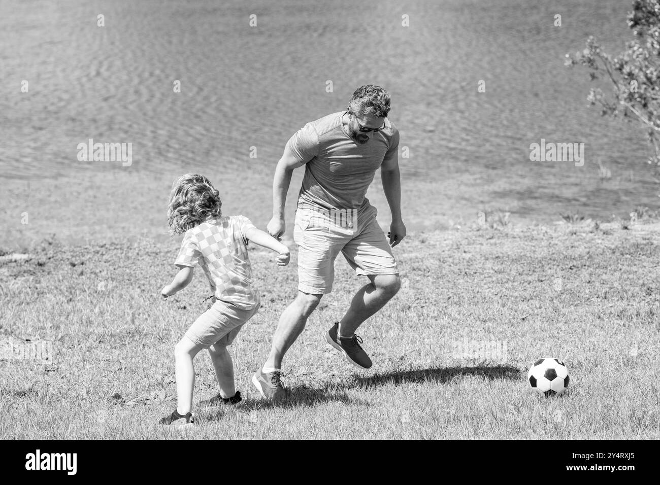 dad and son playing football during their childhood. Childhood memories ...