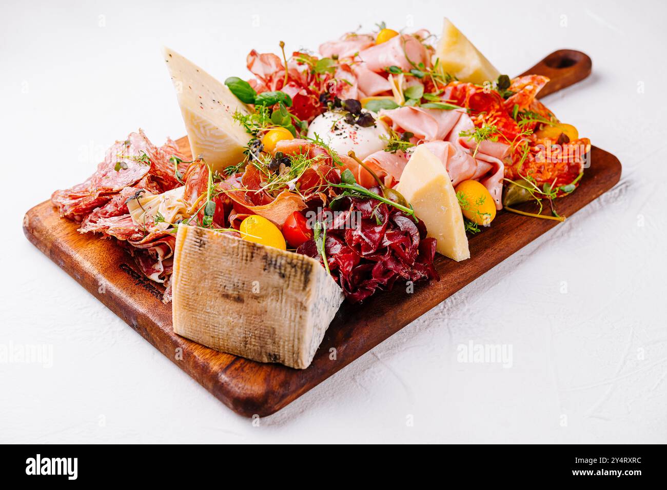 Elegant charcuterie board featuring a variety of cheeses, cured meats ...