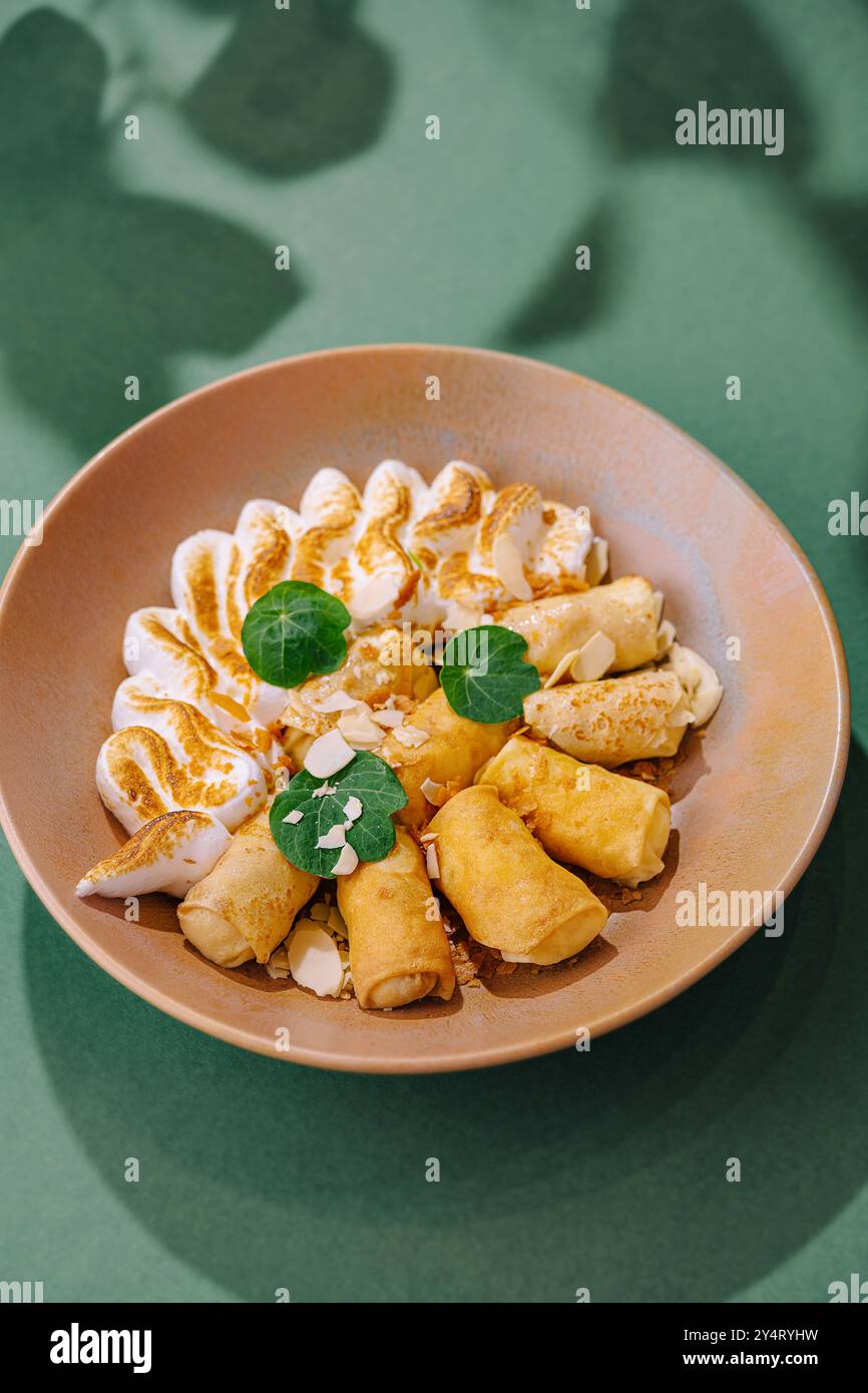 Elegant presentation of crepes with creamy filling and garnish on a ...
