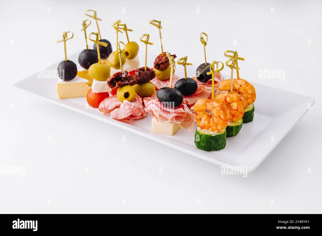 Exquisite gourmet finger food appetizer platter with an elegant assortment of cheese. Shrimp ...