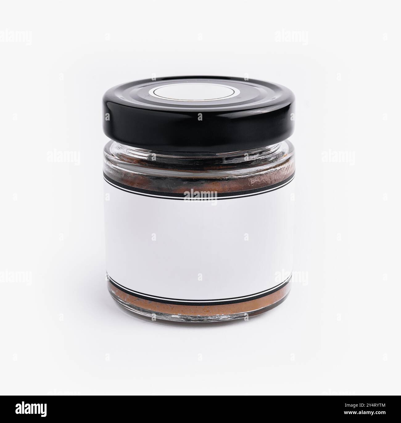 Clear glass jar with a black lid and blank label, isolated on white ...