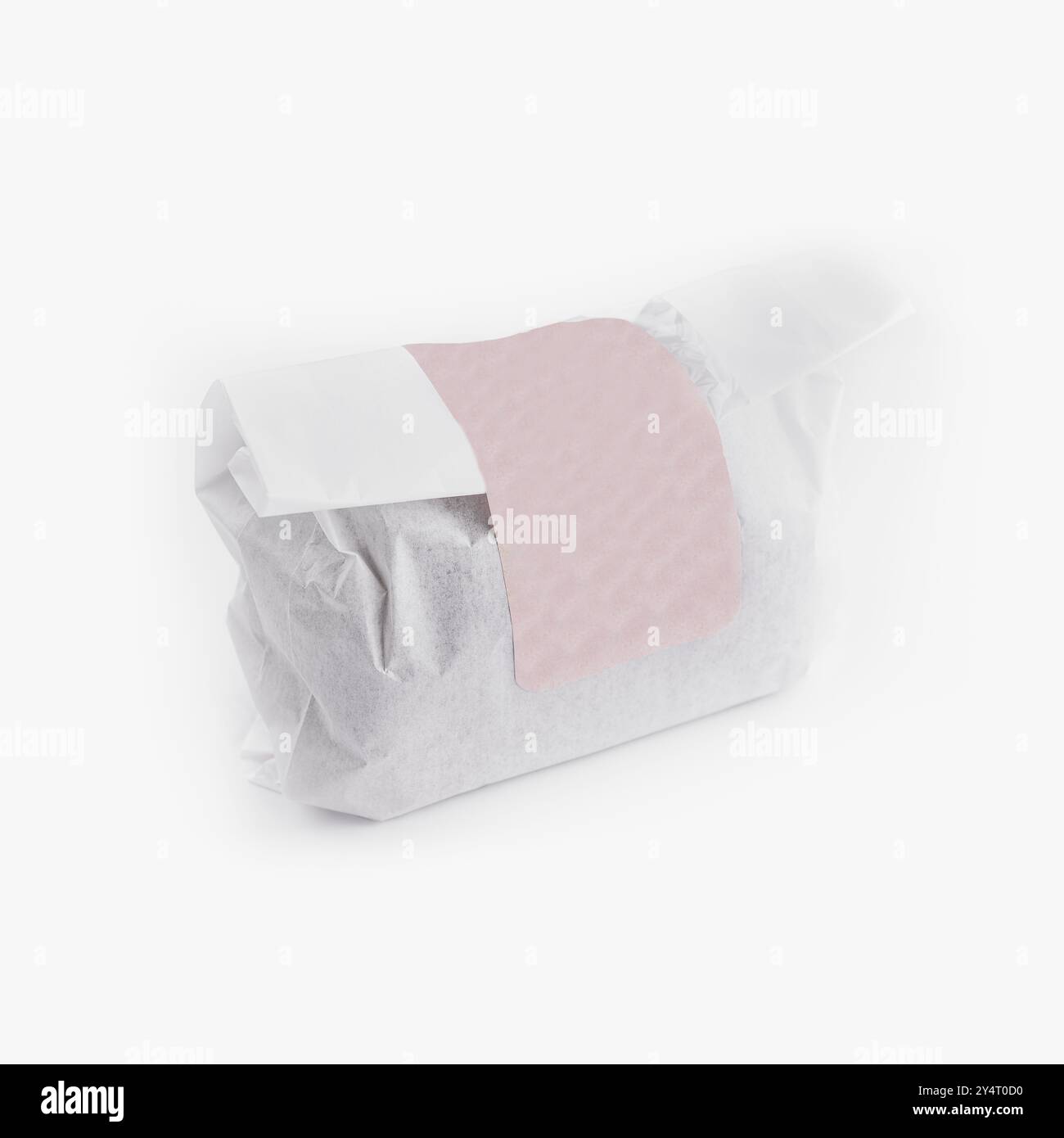 Isolated image of an item wrapped in paper with blank label on white ...
