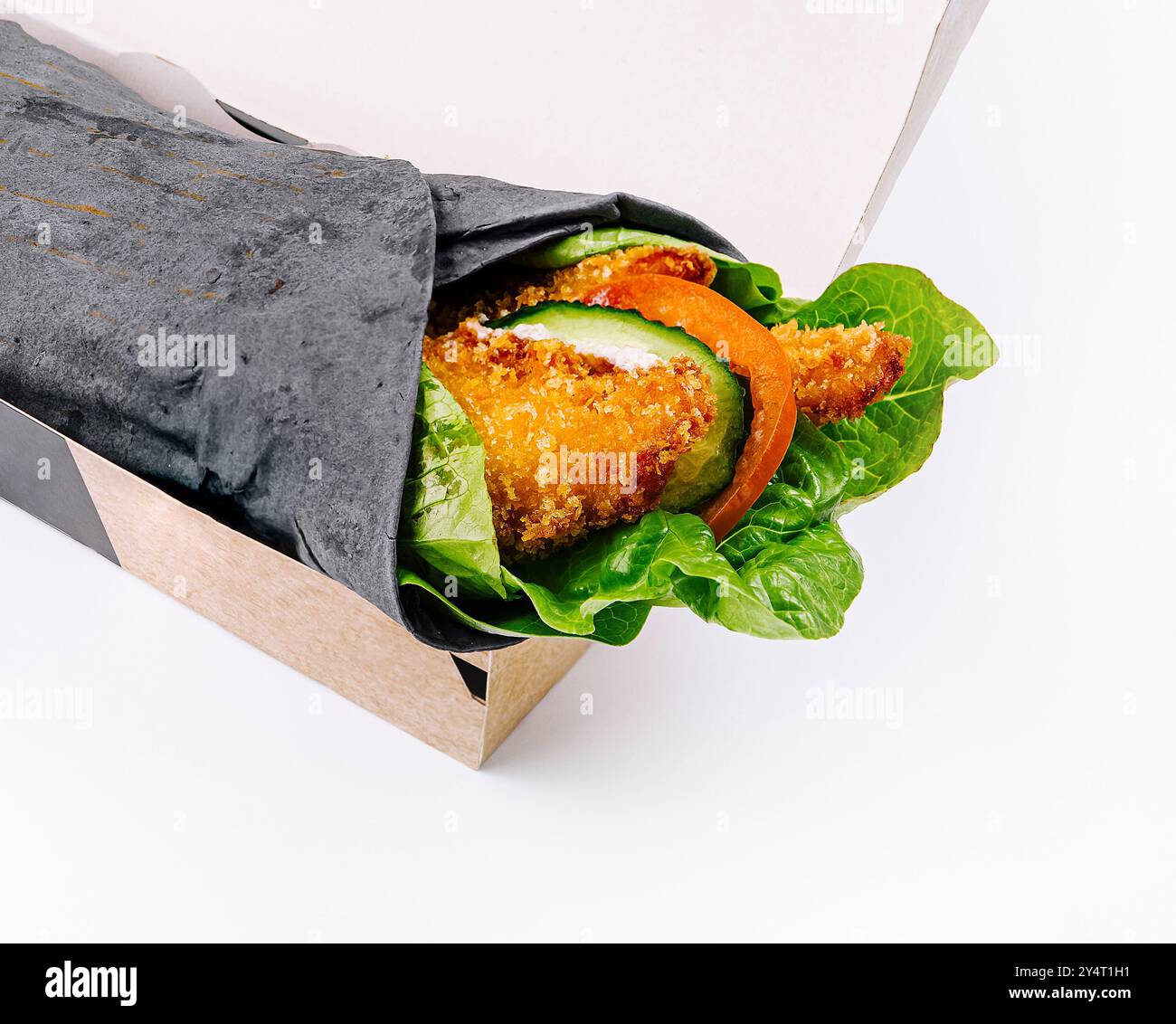Healthy vegetable wrap in eco-friendly packaging, isolated on a white ...