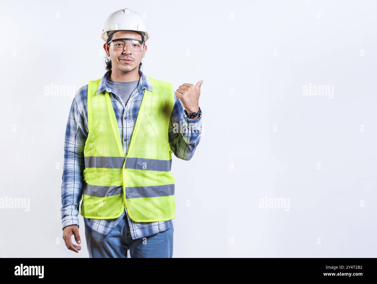 Male construction engineer pointing at an advertisement. Engineer man ...