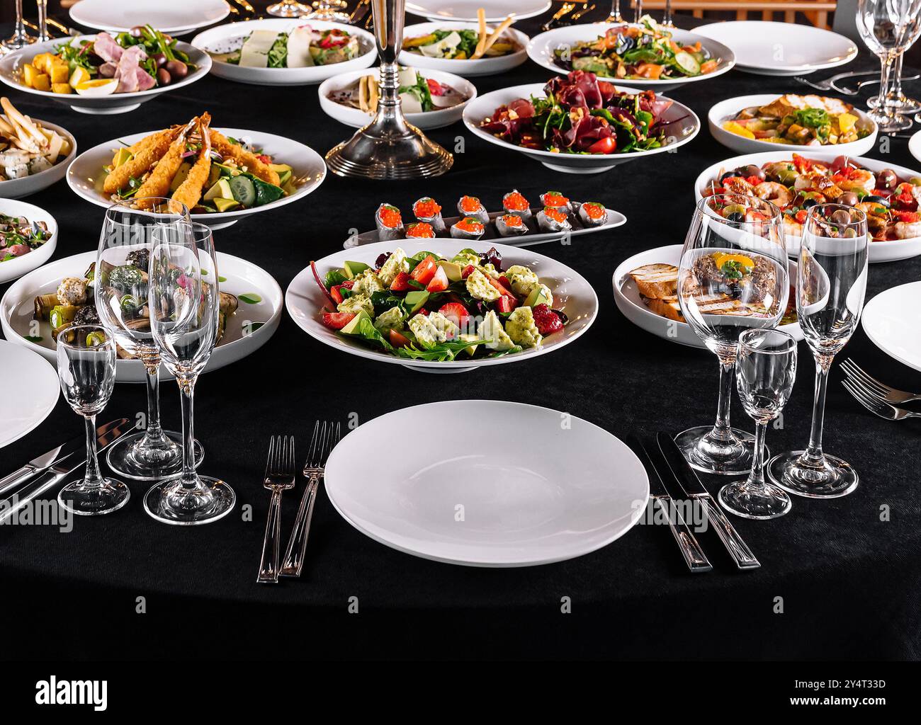 Luxurious banquet table with an array of gourmet dishes, fine china ...