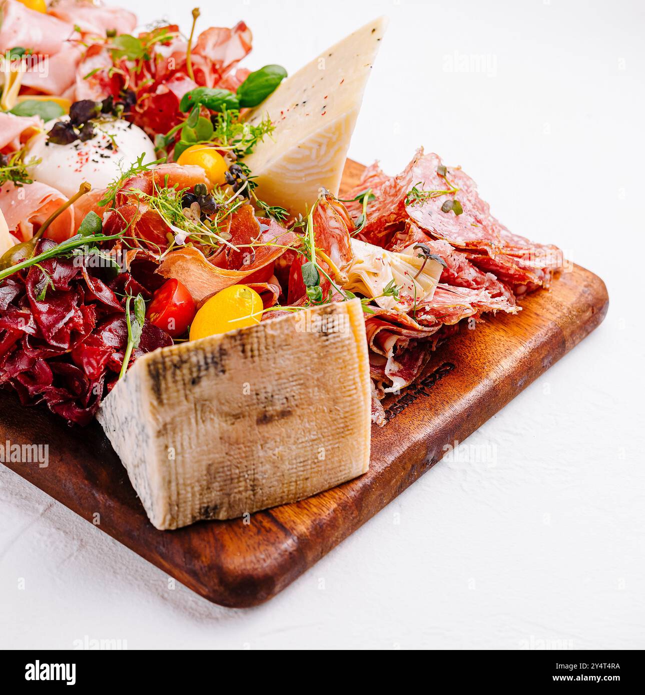 Elegant charcuterie board featuring a variety of cheeses, cured meats ...
