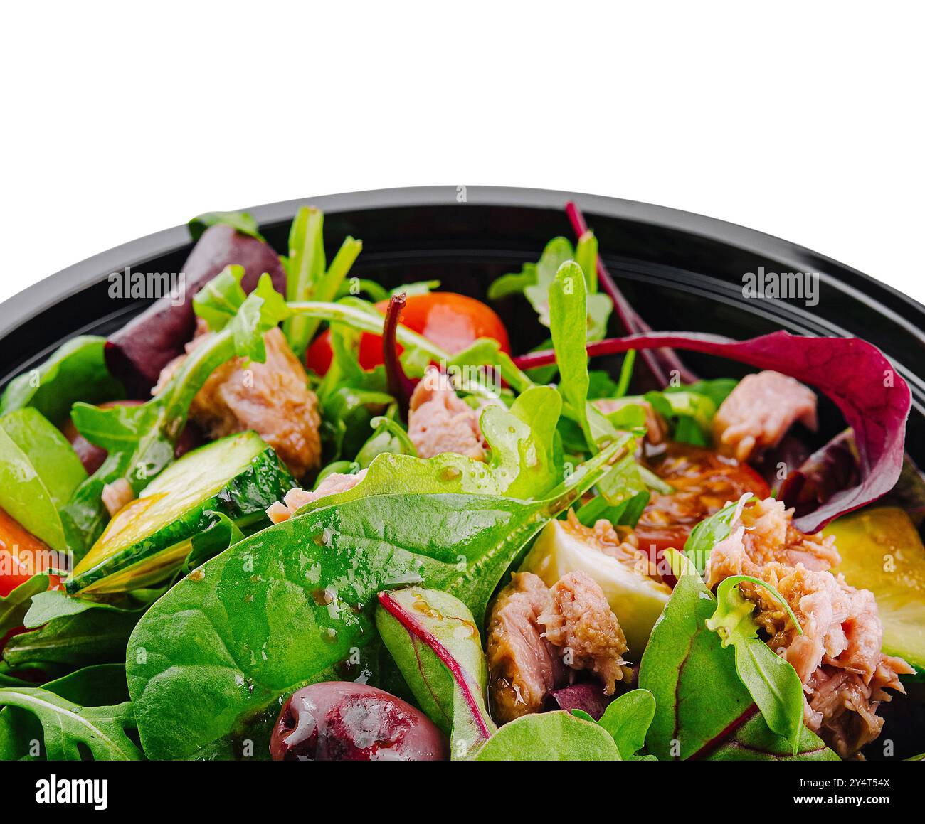 Healthy mix of greens, vegetables, and protein in a black takeaway bowl ...