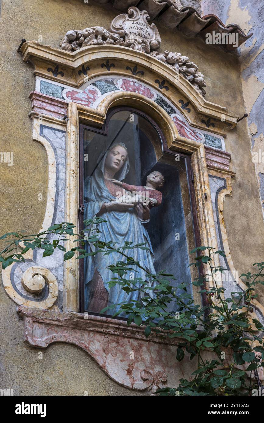Figure of a saint with child in an alley, Christianity, Mary, Jesus ...