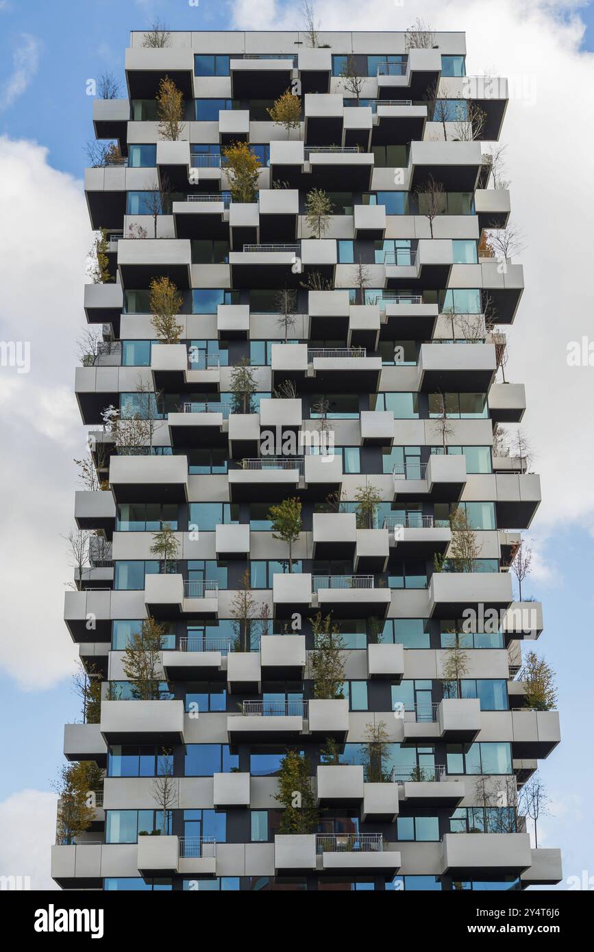 High-rise residential building with integrated planted trees, housing ...