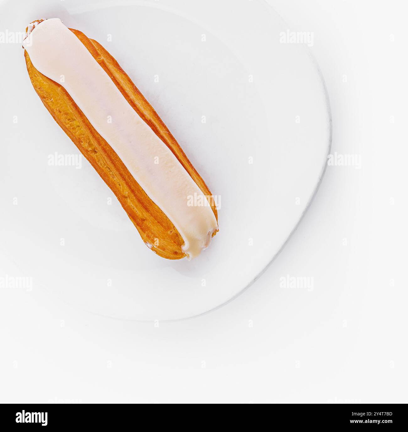 High-angle view of a delicious eclair with creamy icing, perfectly ...