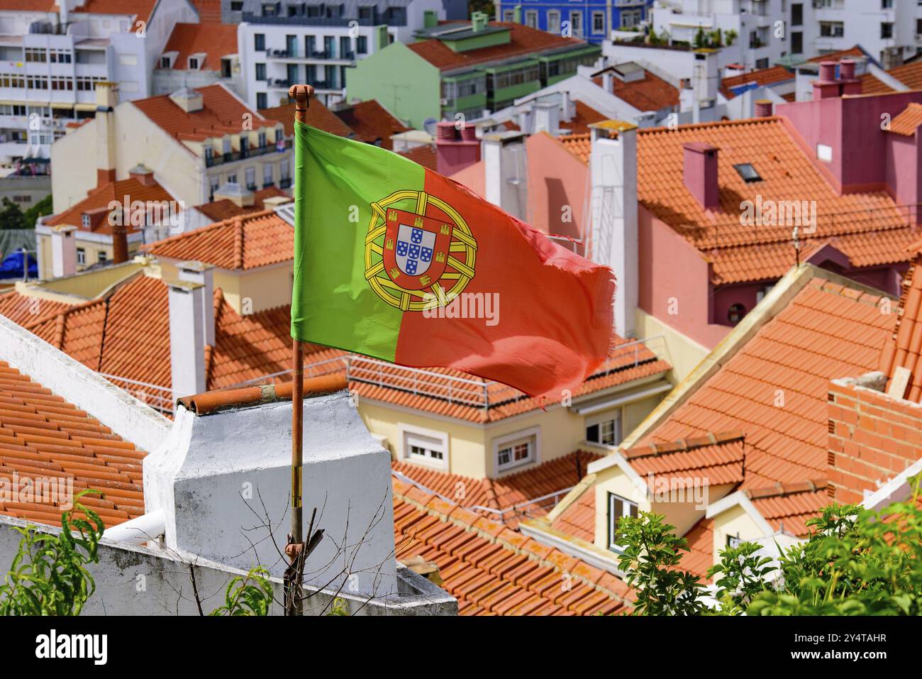 National flag of Portugal with background of the city of Lisbon Stock ...