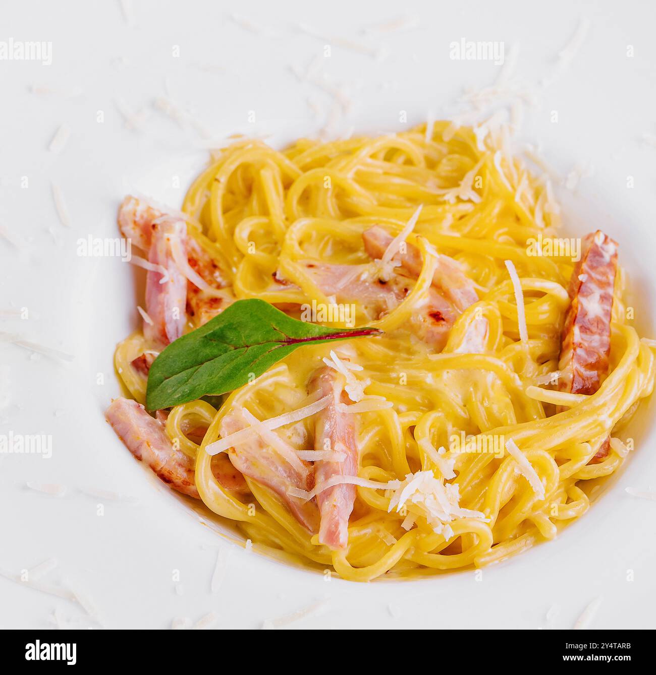 Italian pasta spaghetti carbonara top view garnished with herbs on ...