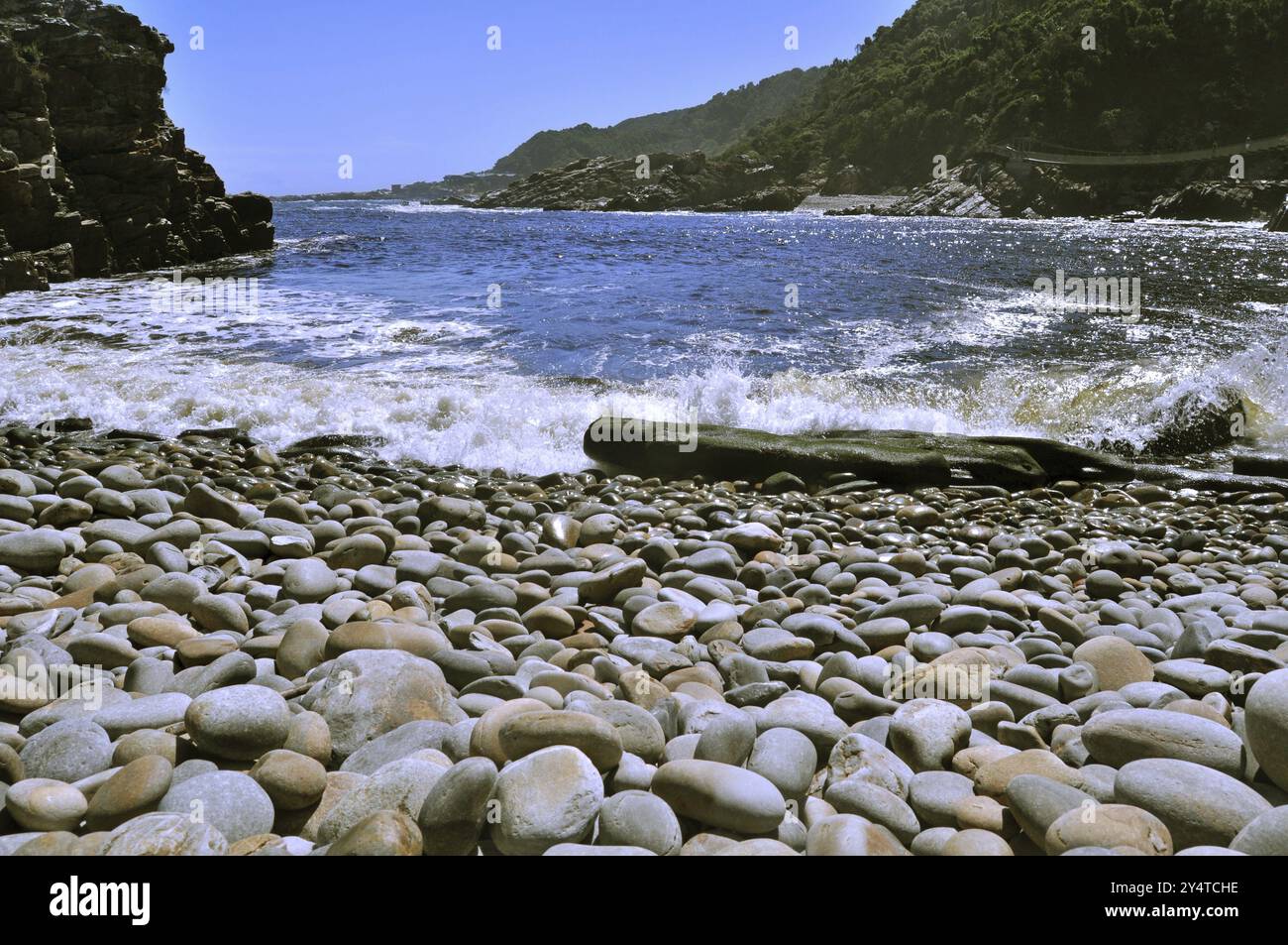 Power of nature grinded rock into round pebbles on a beach in South ...