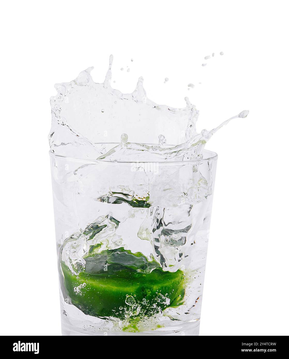 Lime slice dropping into a clear glass of water, creating a dynamic splash, isolated on a white ...
