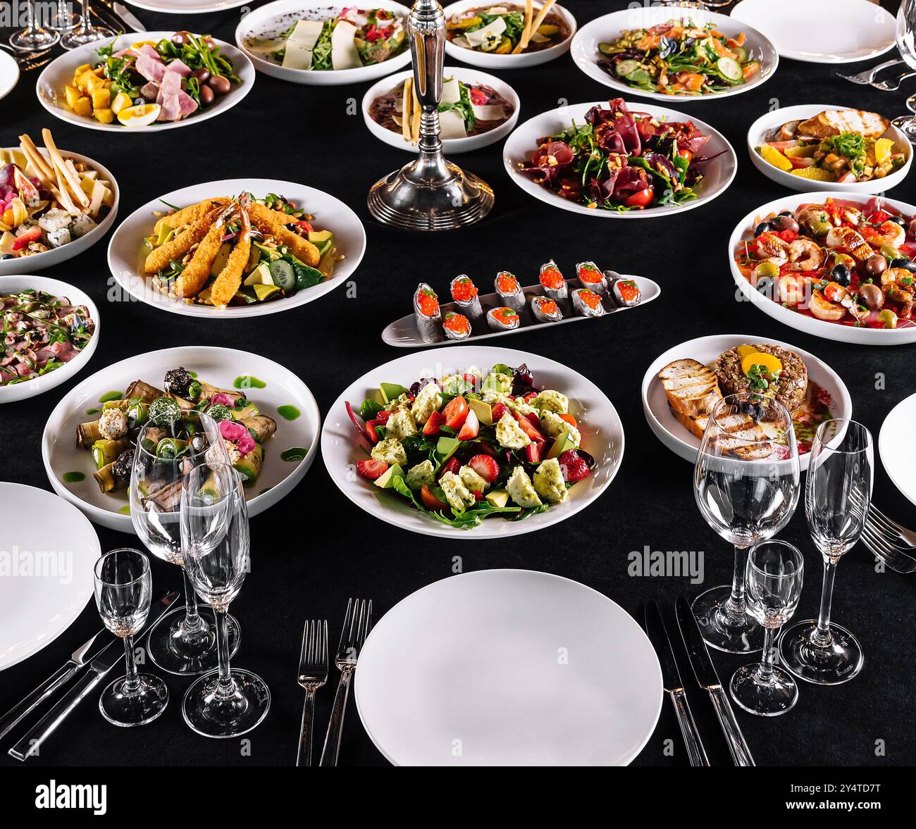 Luxurious dinner table setup with a candelabra and gourmet dishes Stock ...