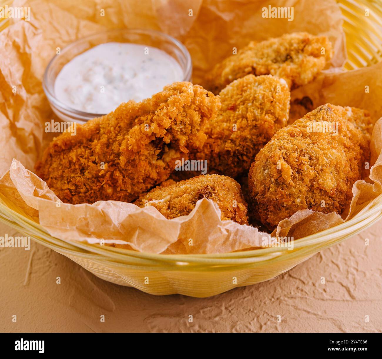 Crisp crunchy golden chicken legs and wings deep fried close up Stock ...