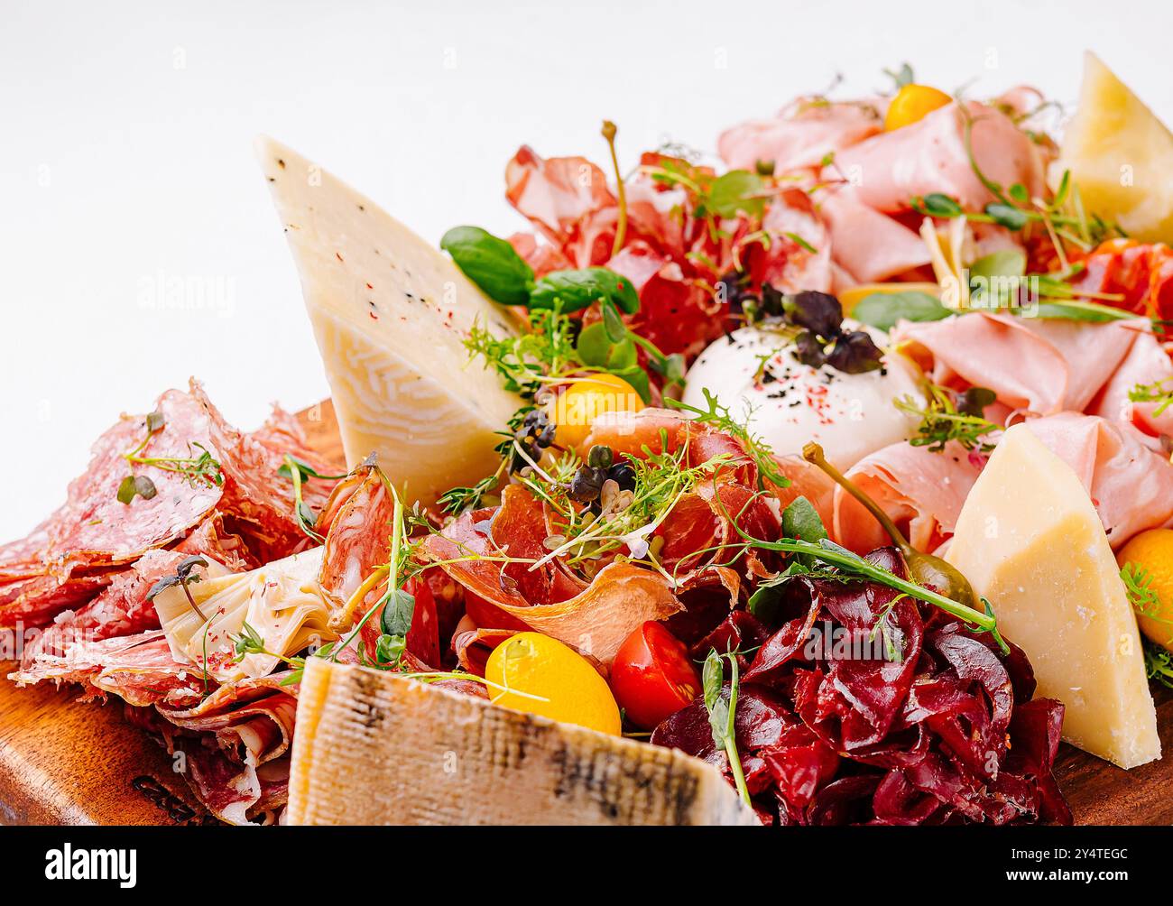 Elegant charcuterie board featuring a variety of cheeses, cured meats ...