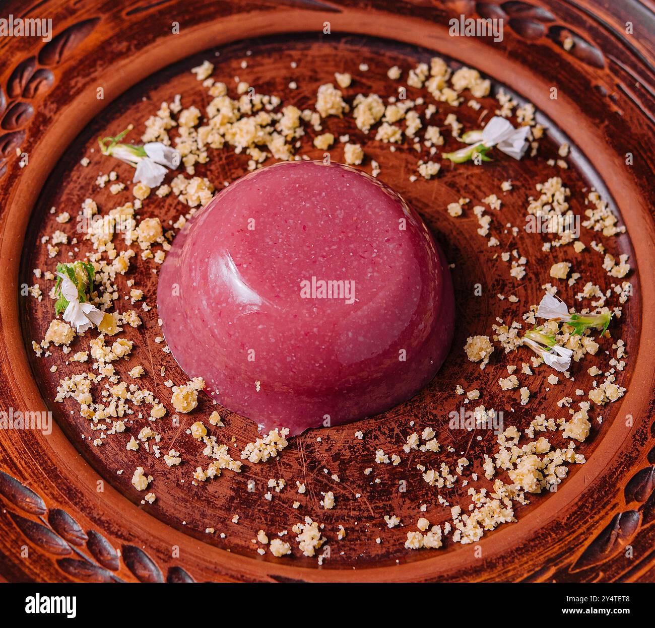 Aesthetic image of raspberry pudding topped with berry sorbet on a ...