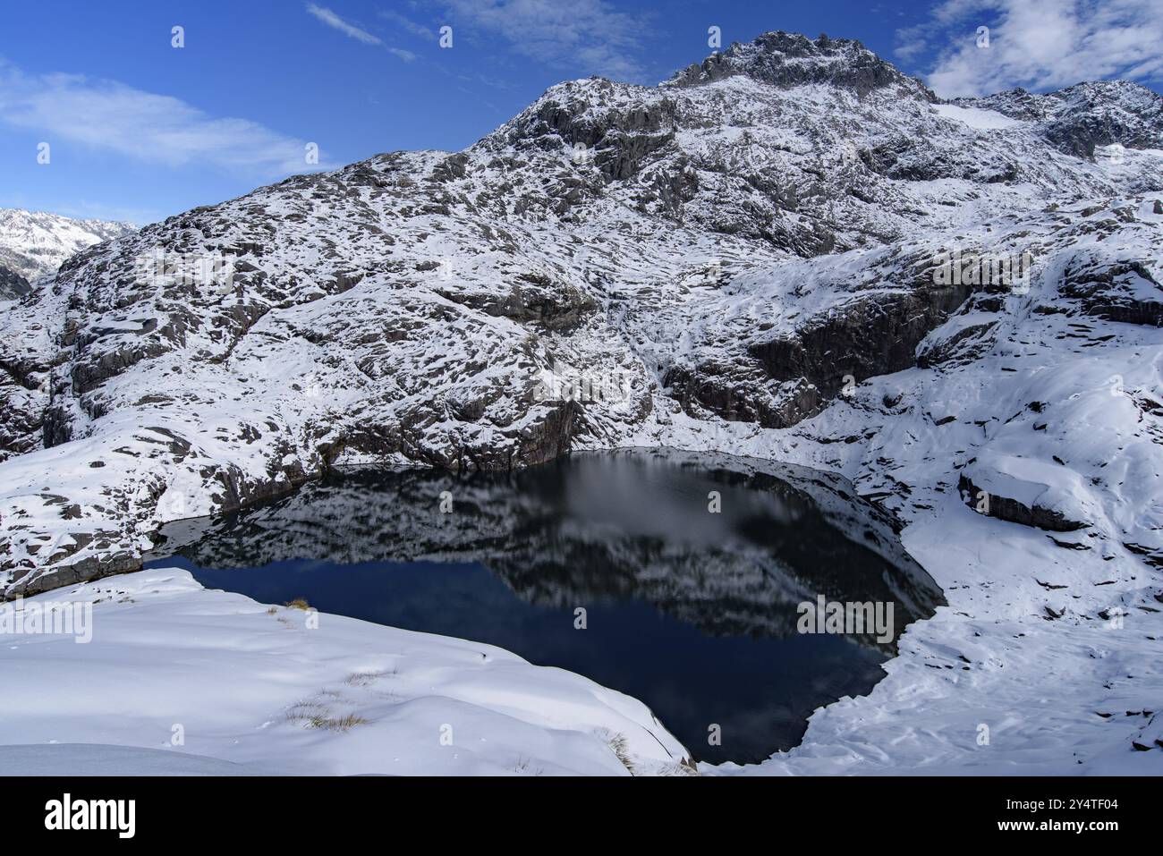 A lake in the snow mountains in Fiordland National Park, New Zealand ...