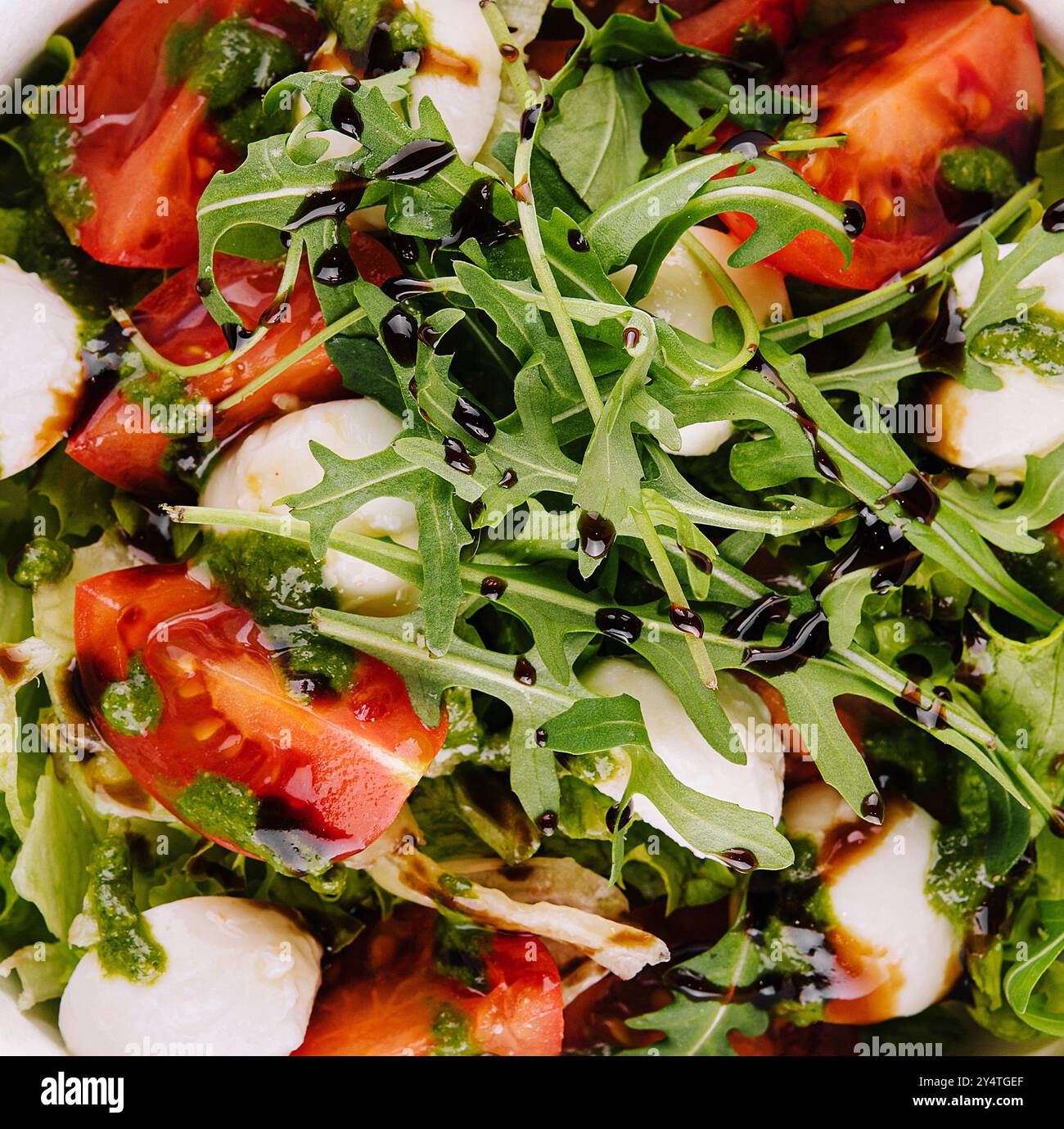 Chorizo salad with cherry tomatoes, mozzarella and wild rucola top view ...