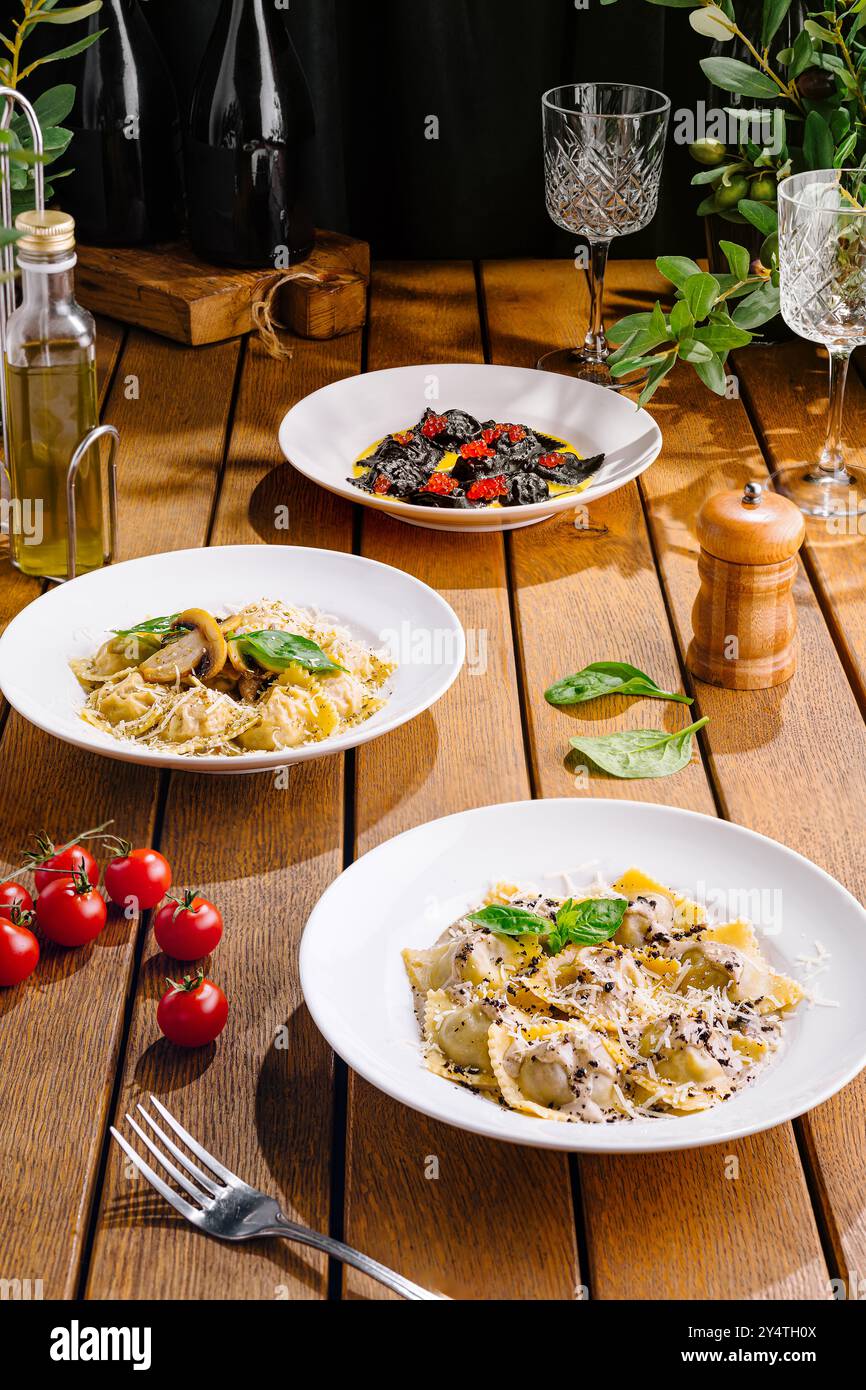 Three types of pasta served elegantly on white plates, ready for a fine ...