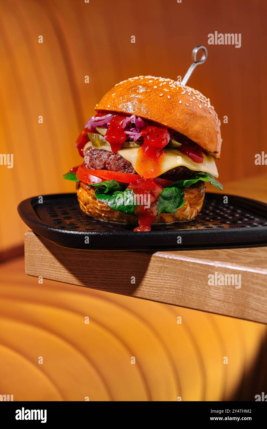 Artfully crafted gourmet burger with fresh toppings on a stylish tray ...