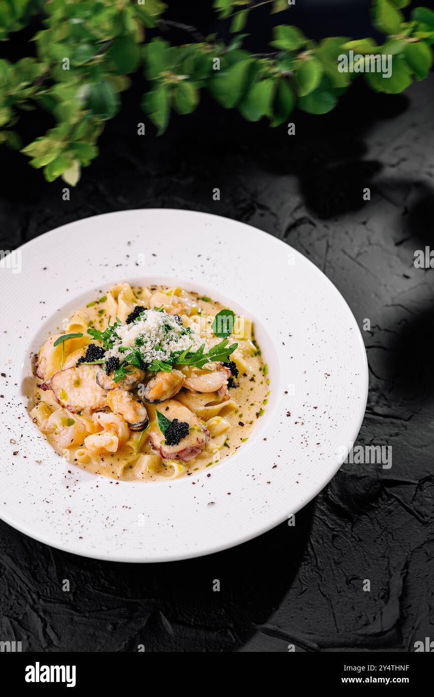 Exquisite shrimp pasta with garnish, served on a classic white plate ...