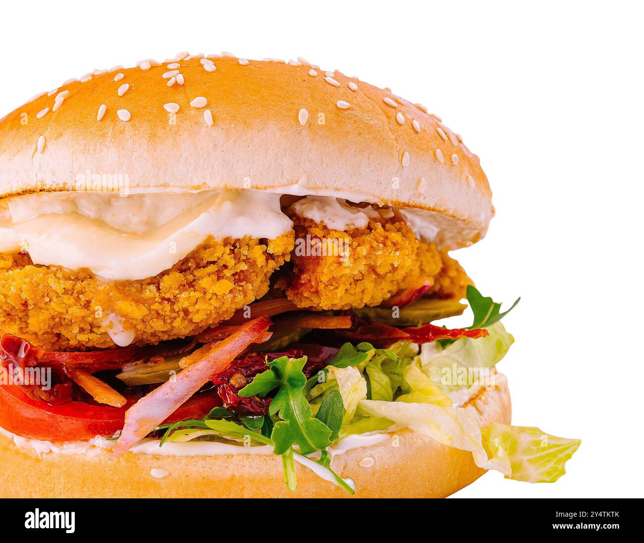 Delicious chicken burger with fresh toppings and creamy sauce on a ...