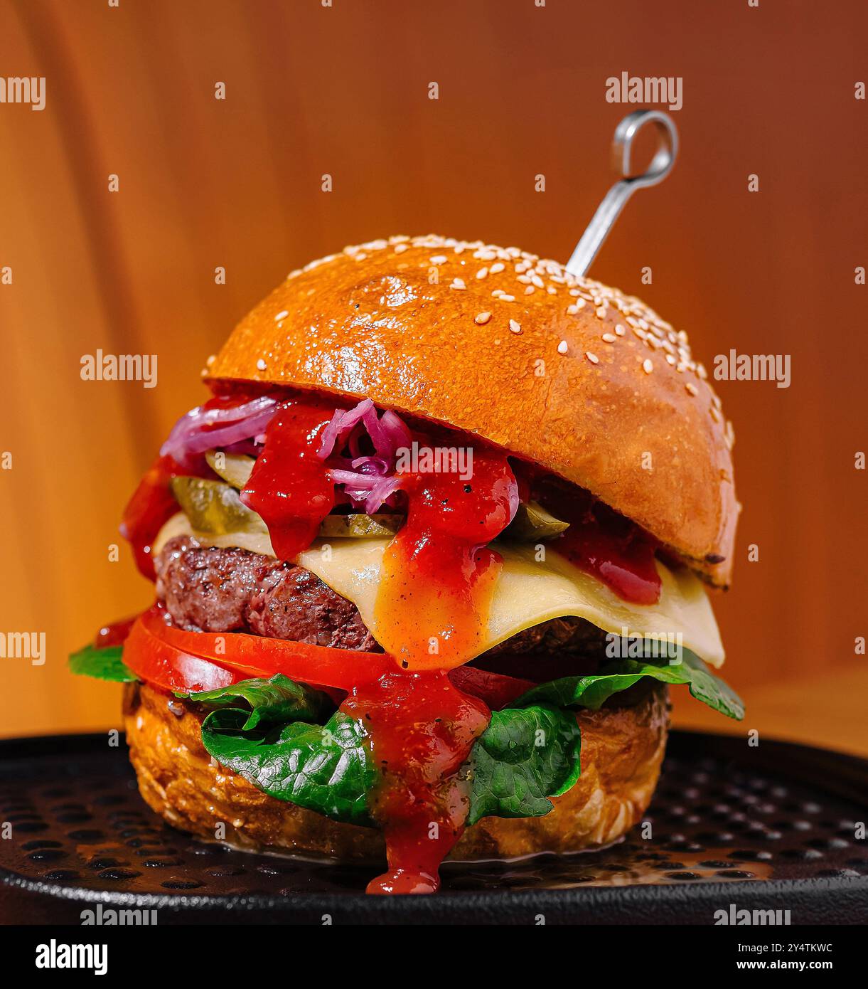 Artfully crafted gourmet burger with fresh toppings on a stylish tray ...