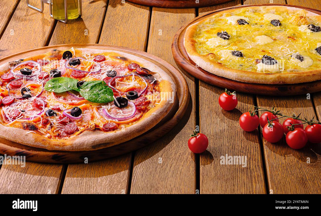 Delicious variety of pizzas on a cozy setup Stock Photo - Alamy