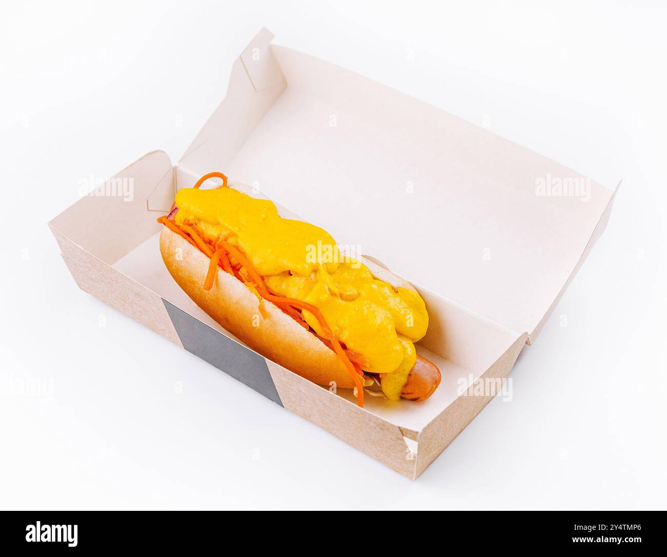 Delicious hot dog topped with melted cheese in a cardboard box ...