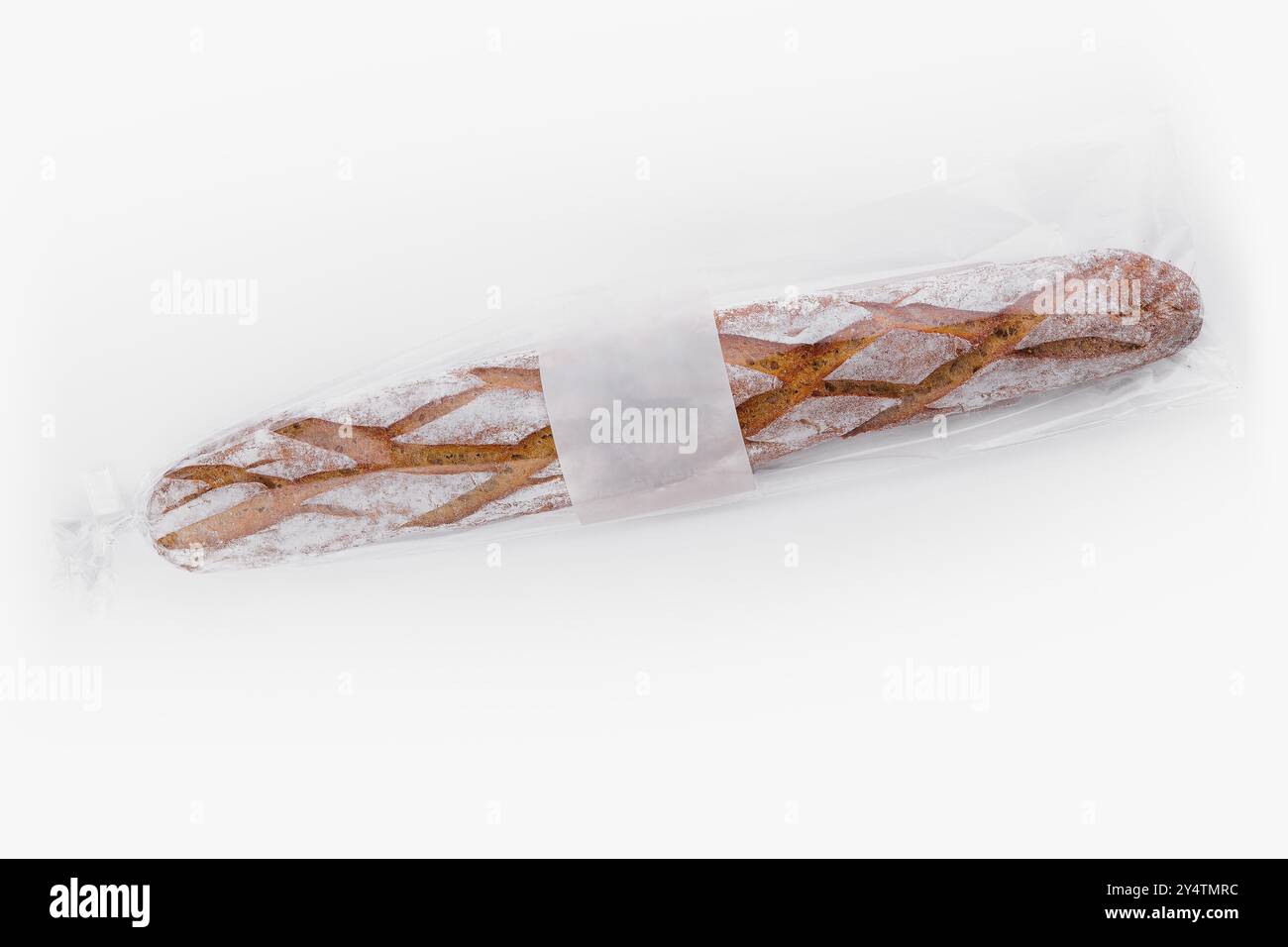 Fresh artisanal bread in plastic packaging isolated on a white ...