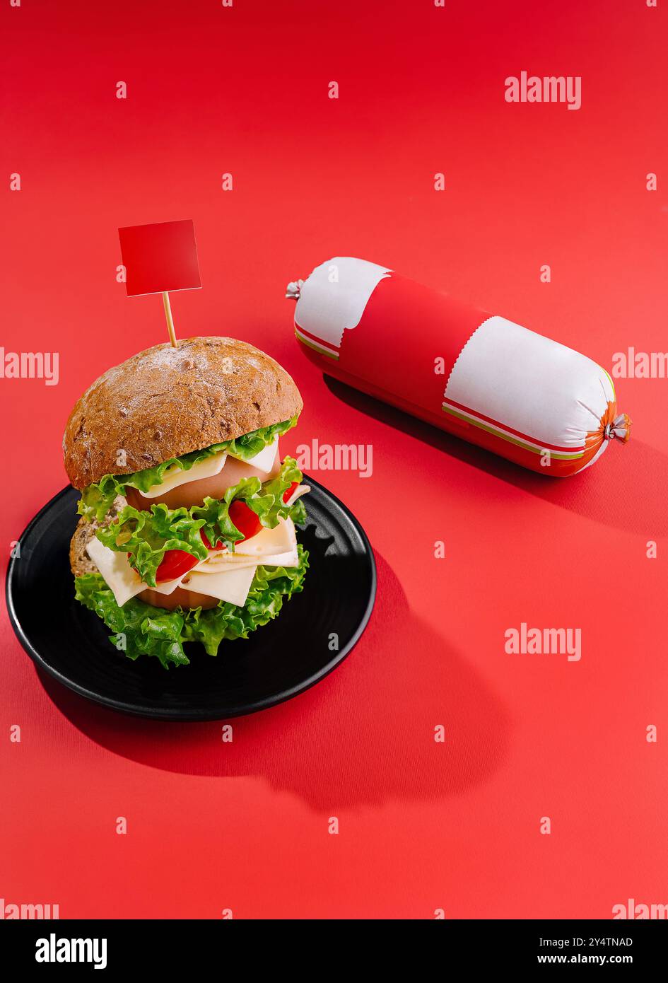 Double burger with fresh vegetables and a sausage with blank labels are ...