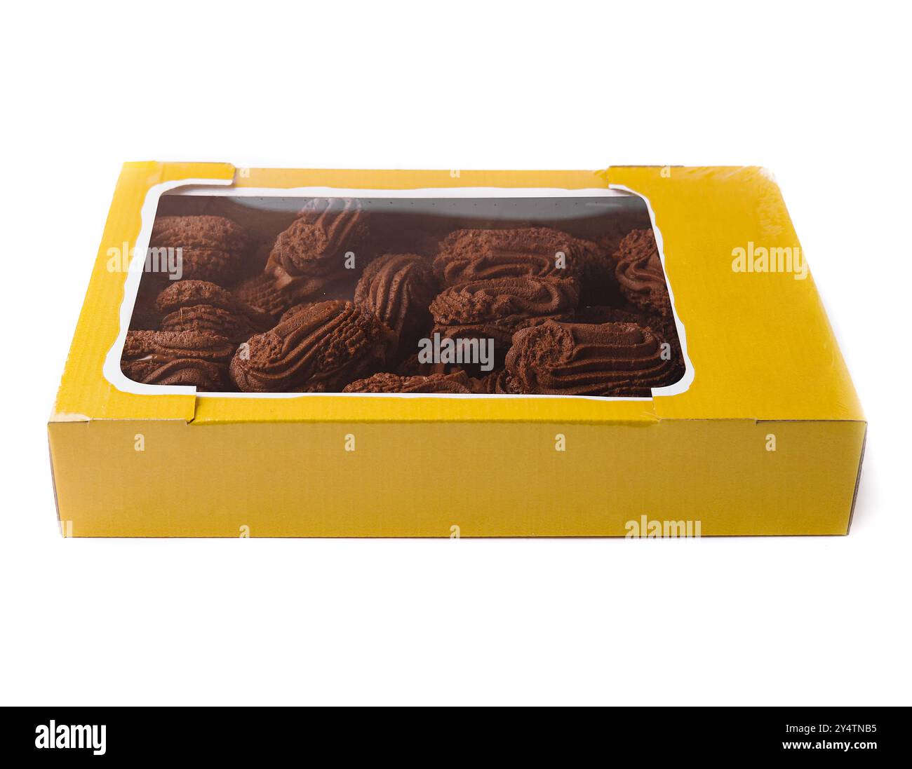 Chocolate spritz cookies with swirl design laying inside yellow ...