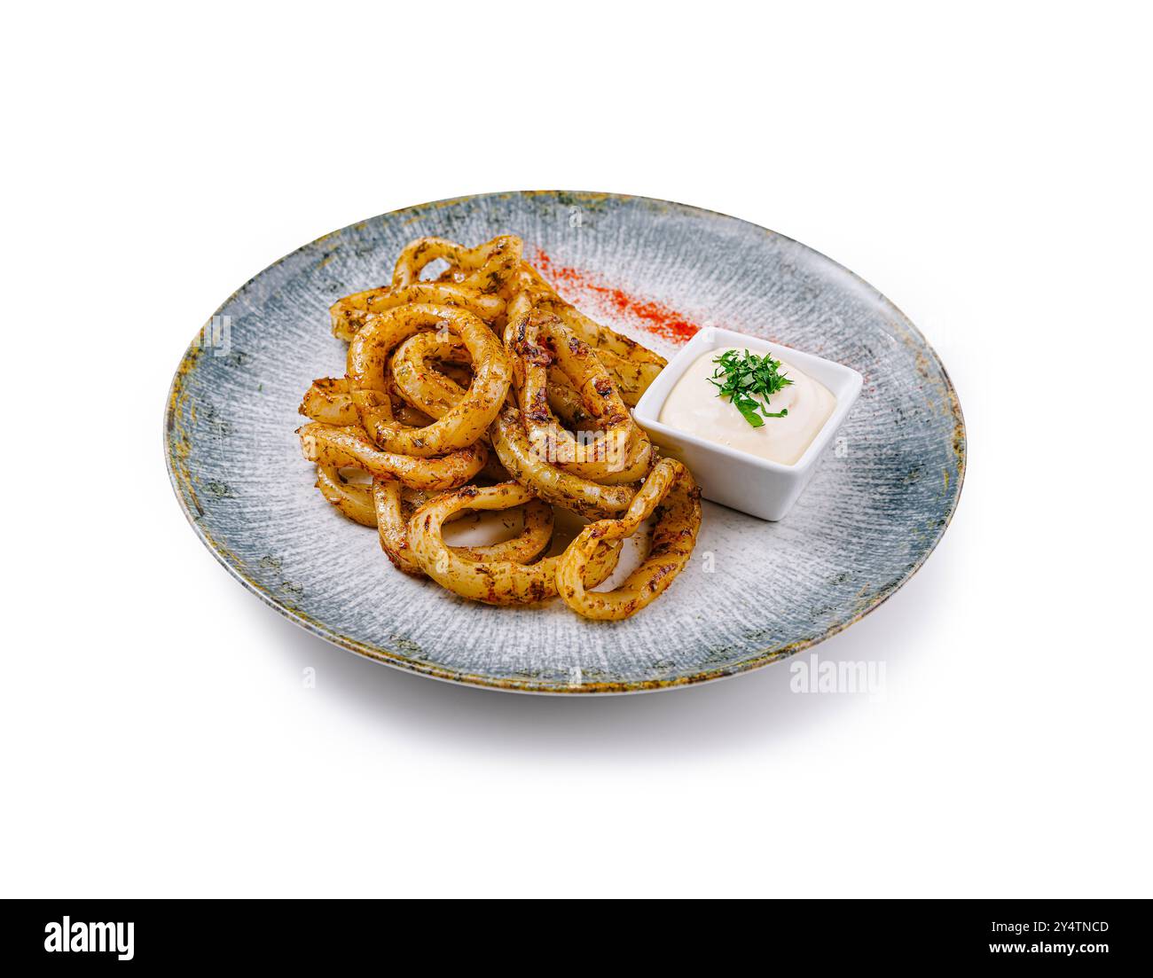 Deep fried calamari rings seasoned with herbs and spices served on a ...