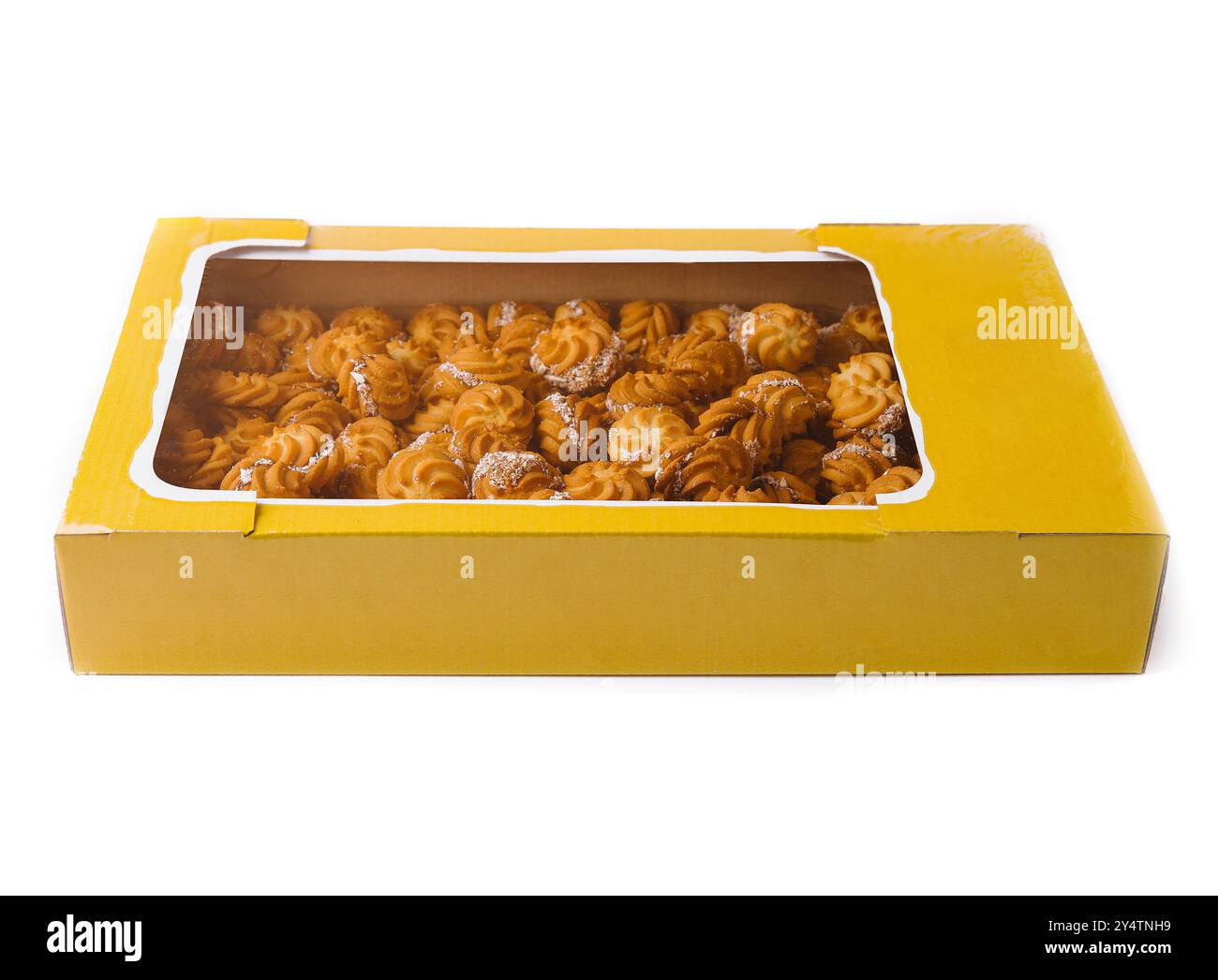 Kurabie cookies covered with powdered sugar lying in a yellow cardboard ...