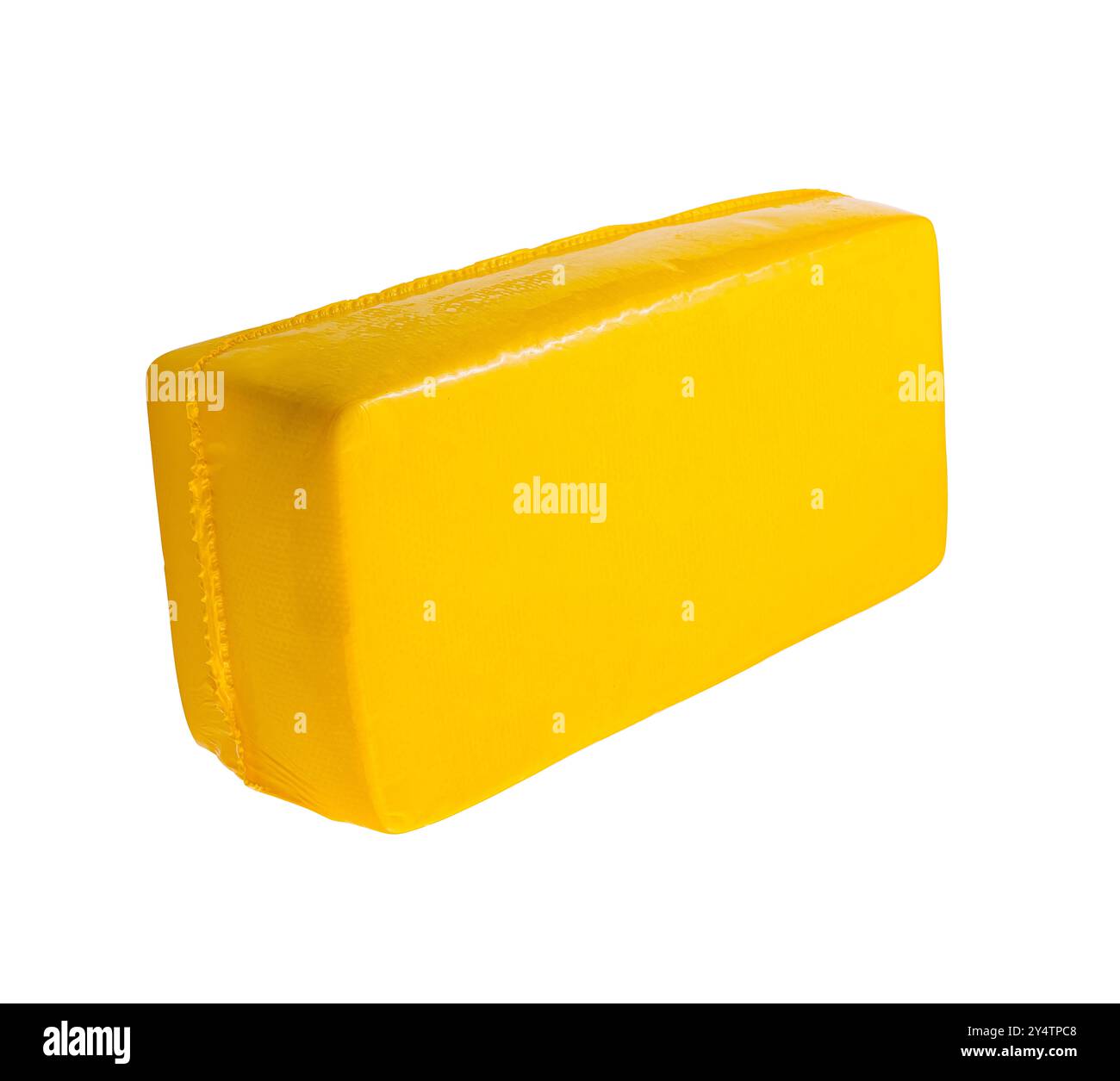 Large rectangular block of yellow cheese is vacuum packed and sealed in ...