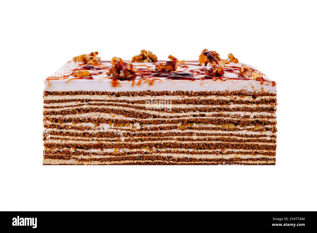 Delicious multi-layered cake with walnuts and caramel topping, isolated ...