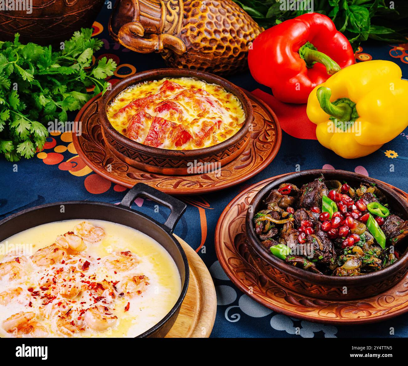 Variety of georgian dishes in traditional clay pots on a table with a ...