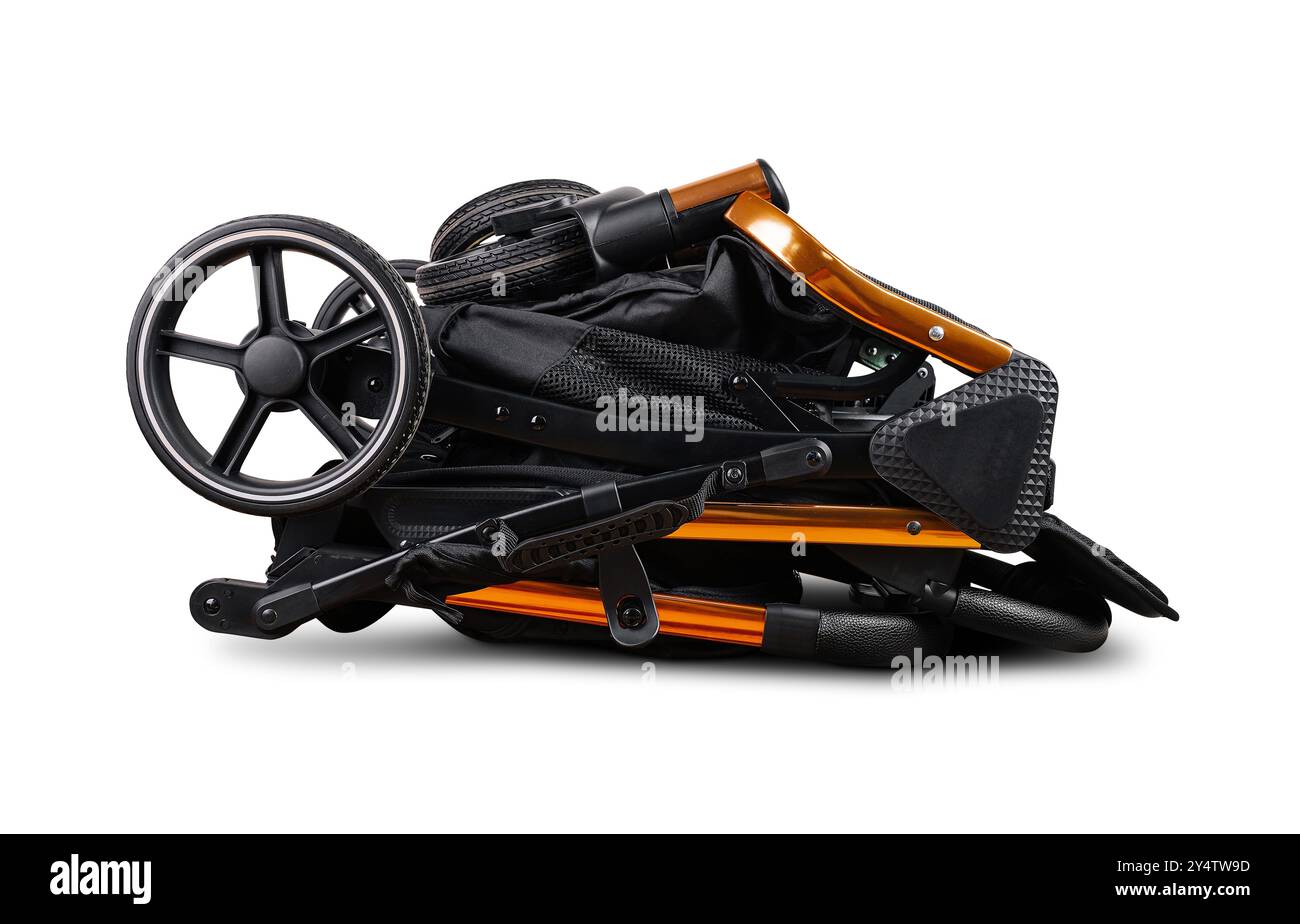 Modern orange and black folded baby stroller standing on a white ...