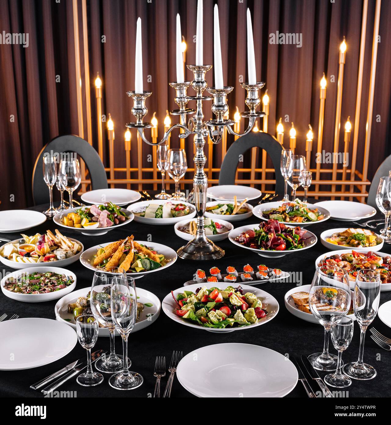 Luxurious dining table arrangement with candles hi-res stock ...