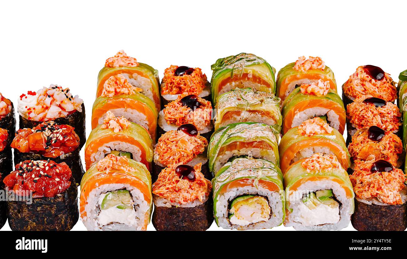 Different types of sushi rolls are lying in a row on a white background ...