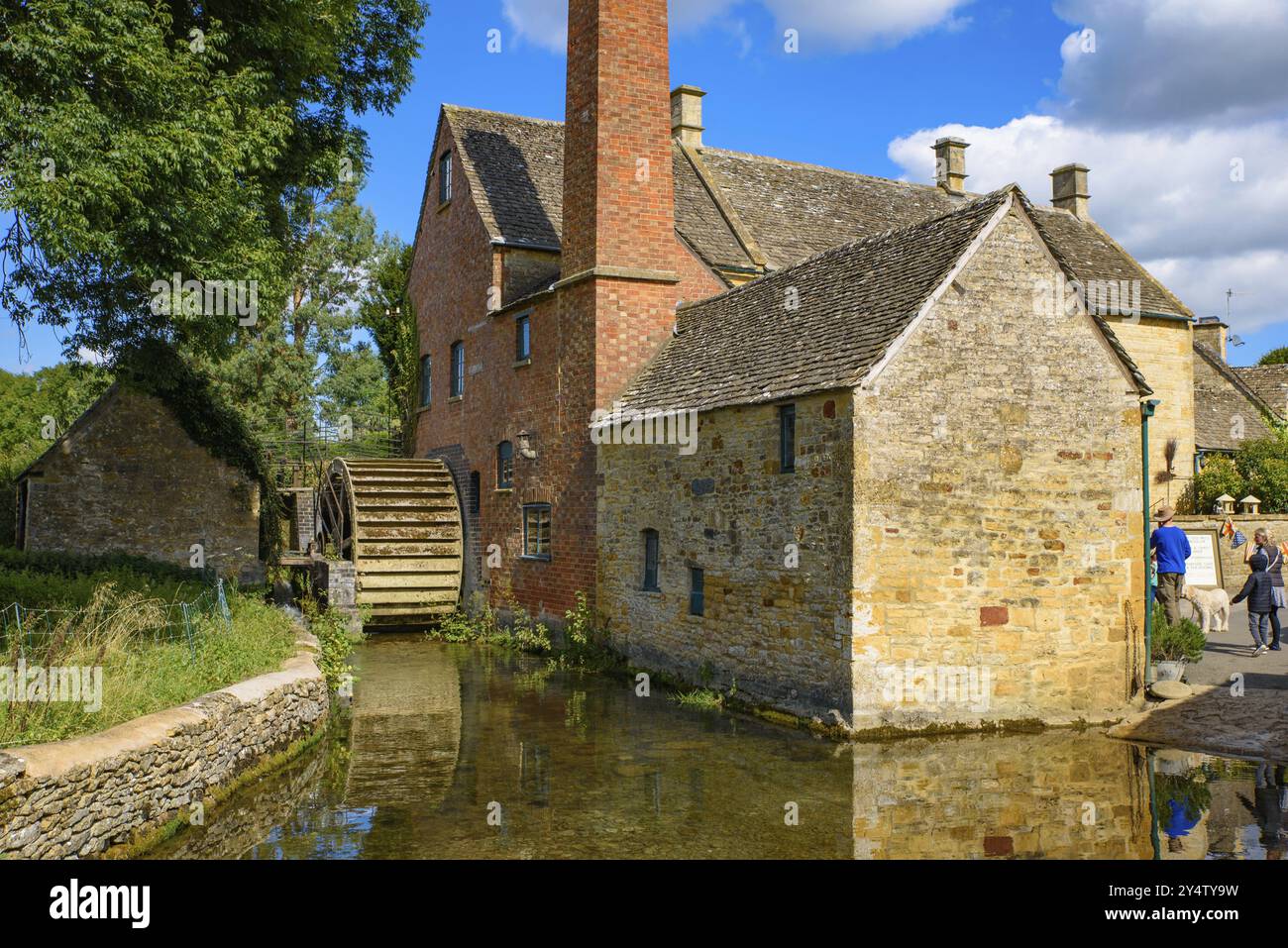 Old water mill in Lower Slaughter, a village in Cotswolds area, England ...